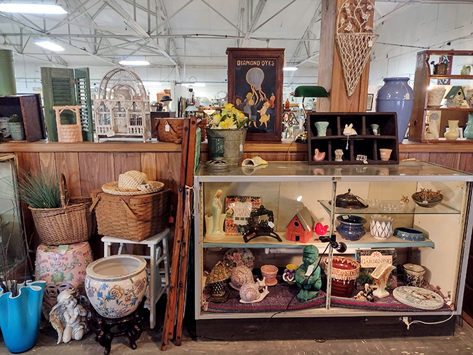 Every shelf tells a story in this carefully curated booth. From vintage advertisements to handcrafted pottery, history surrounds you.