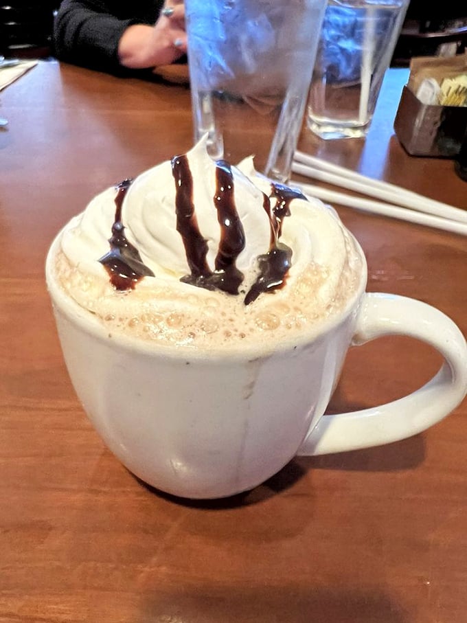 Hot chocolate that doesn't just warm your hands but sends your taste buds to therapy—whipped cream melting into chocolate bliss.