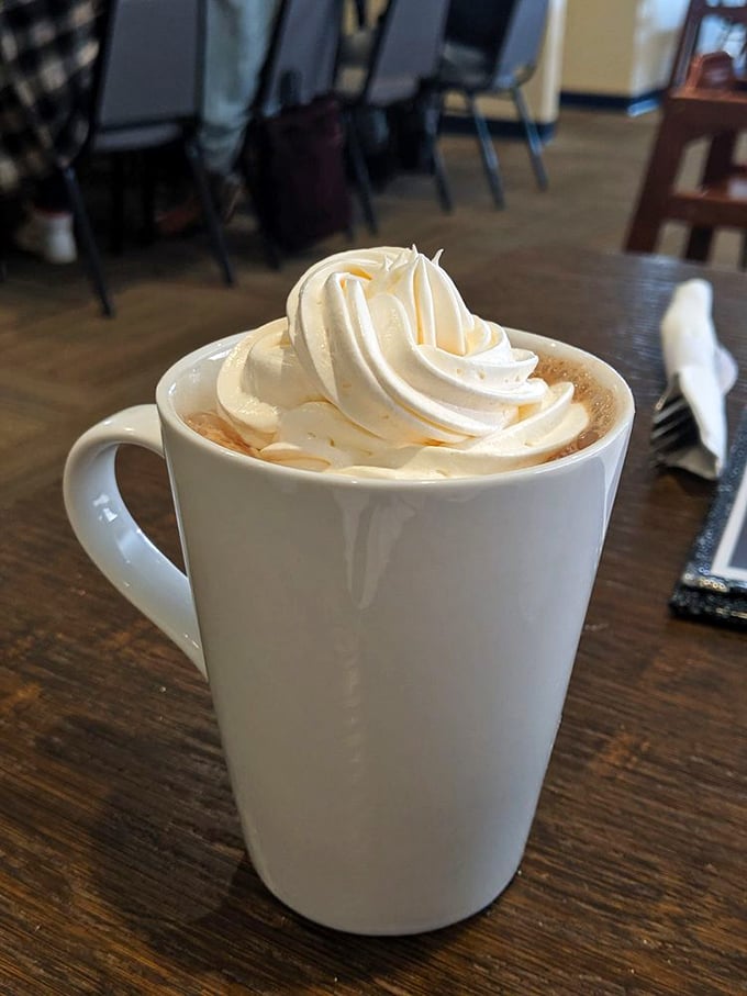 Hot chocolate elevated to an art form – topped with a swirl of whipped cream so perfect it deserves its own Instagram account.