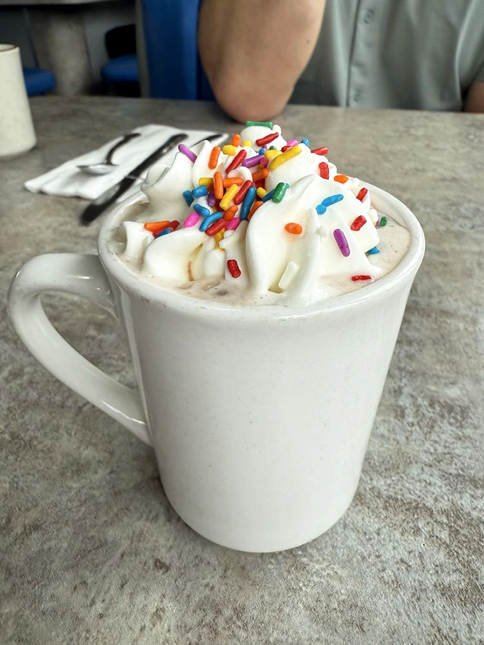 Hot chocolate that doesn't just warm your hands but your soul—topped with whipped cream and sprinkles for your inner child.