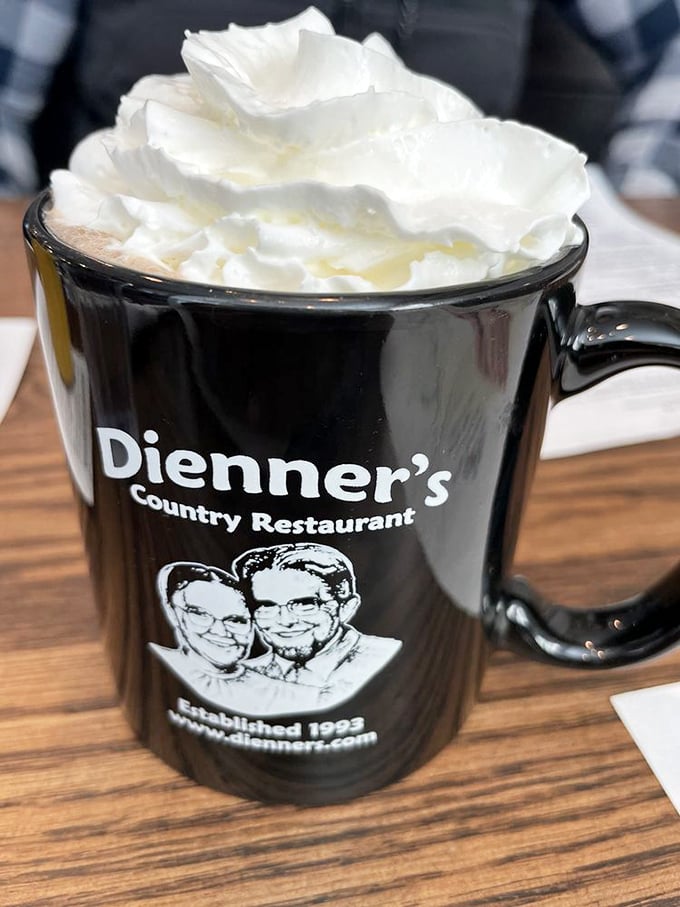 Hot chocolate crowned with a cloud of whipped cream so impressive it deserves its own weather forecast.