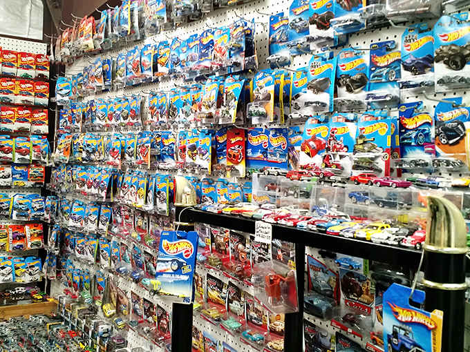 Wall-to-wall Hot Wheels heaven! For collectors, this display is the equivalent of finding the Holy Grail—if the Holy Grail came in tiny packages with racing stripes.