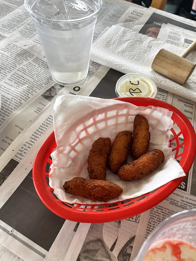 Hush puppies so good they deserve their own moment of silence—crispy, golden-brown bites of cornmeal heaven.