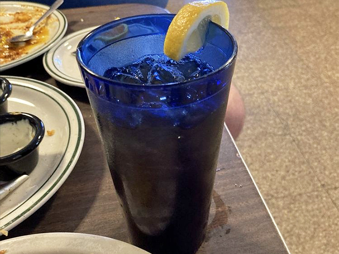 That cobalt blue glass isn't just serving iced tea—it's serving Southern hospitality in liquid form. The lemon wedge is just showing off.