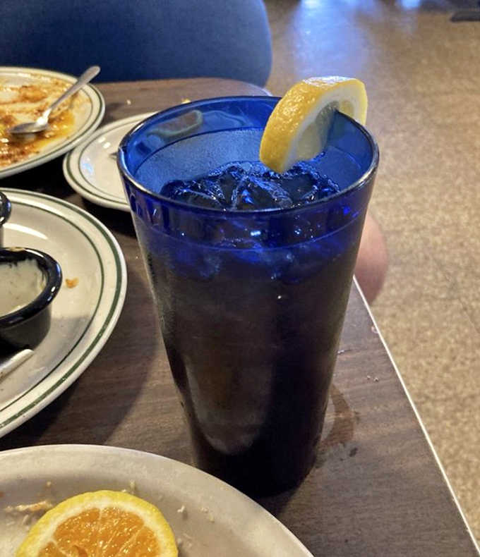 That iconic blue glass of sweet tea—the unofficial wine of the South, served properly chilled with a lemon slice.