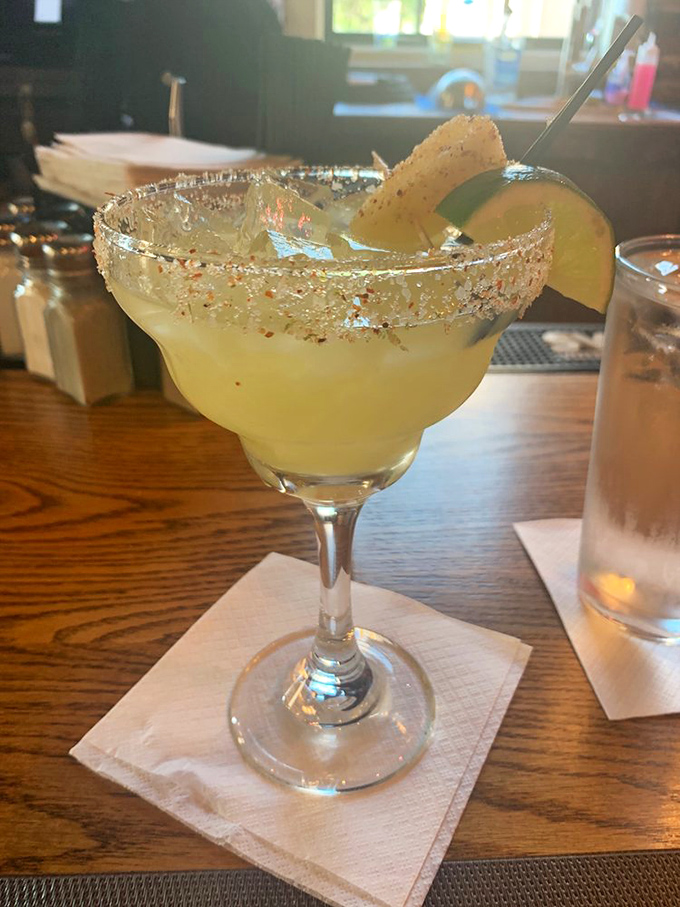 This isn't just a margarita—it's liquid sunshine with attitude. The salt rim sparkles like tiny diamonds for your taste buds.
