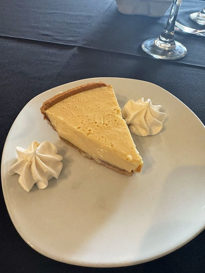 Key lime pie so authentic it should come with its own Florida citizenship papers. Those whipped cream dollops? Pure genius.