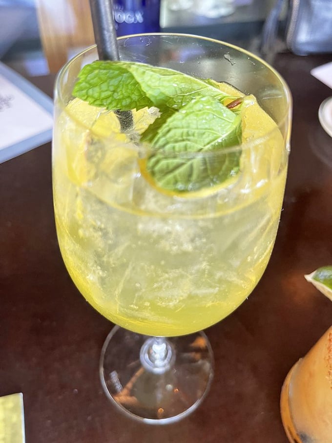 This isn't just a cocktail—it's sunshine in a glass. The Lillet Spritz with fresh mint brings Mediterranean vibes to your West Hollywood seafood adventure.