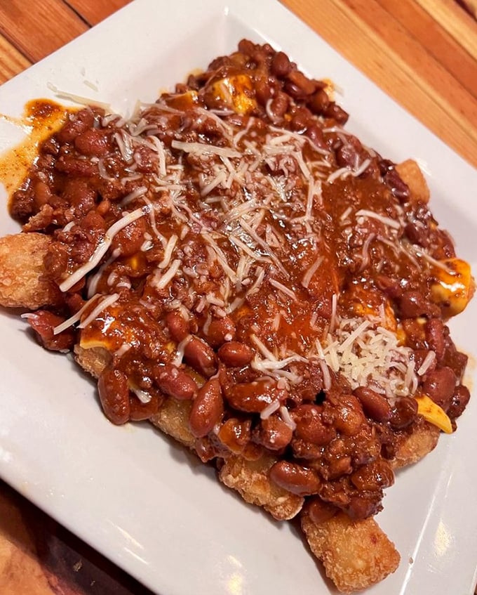 Tater tots elevated to an art form—smothered in chili, cheese, and hope. Comfort food that hugs your soul from the inside.