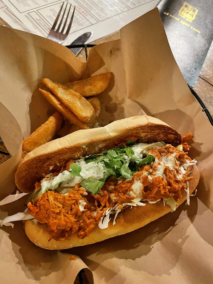 A sandwich that demands both hands and your full attention – tender meat, vibrant sauce, and fresh toppings on a roll that's up to the task.