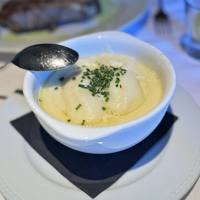 Mashed potatoes so smooth they make silk pajamas feel like sandpaper. That sprinkle of chives is the culinary equivalent of a perfect accessory.