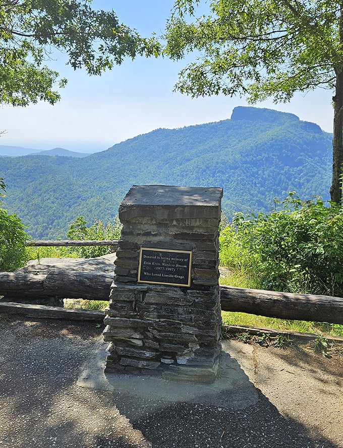 A quiet memorial stands sentinel, reminding us that these mountains have touched countless lives throughout history.
