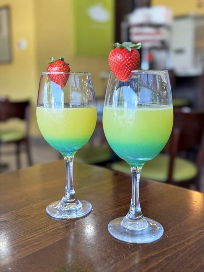 Mermaid Mimosas—where breakfast meets vacation vibes. These blue-yellow gradient beauties topped with strawberries are basically Florida in a glass.