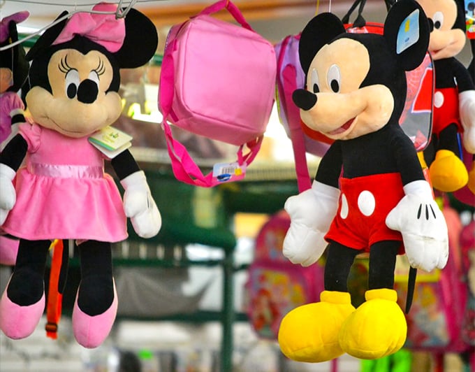 Mickey and Minnie hanging around, waiting to go home with you. Disney magic at flea market prices—now that's the real fantasy.