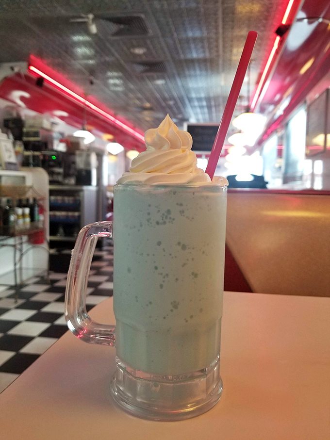This isn't just a milkshake—it's a blue-hued fantasy topped with a cloud of whipped cream that would make your childhood self hyperventilate with excitement.