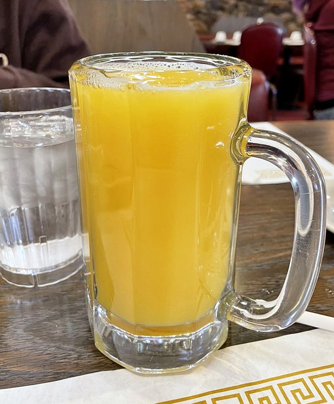 This mimosa isn't just a drink—it's liquid sunshine in a mug. When breakfast beverages come in vessels this size, day drinking becomes a noble pursuit.