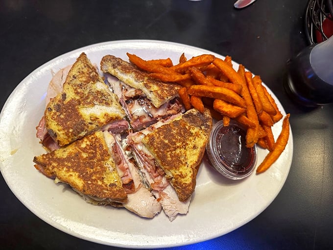 The Monte Cristo: where French toast meets deli sandwich in a marriage that shouldn't work but absolutely does. Sweet potato fries add a modern twist.