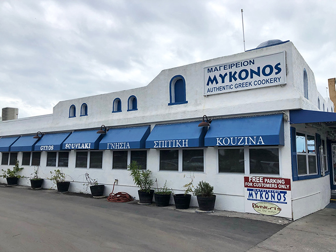 Mykonos restaurant's blue and white exterior transports diners straight to the Aegean—no passport required for this authentic Greek culinary journey.