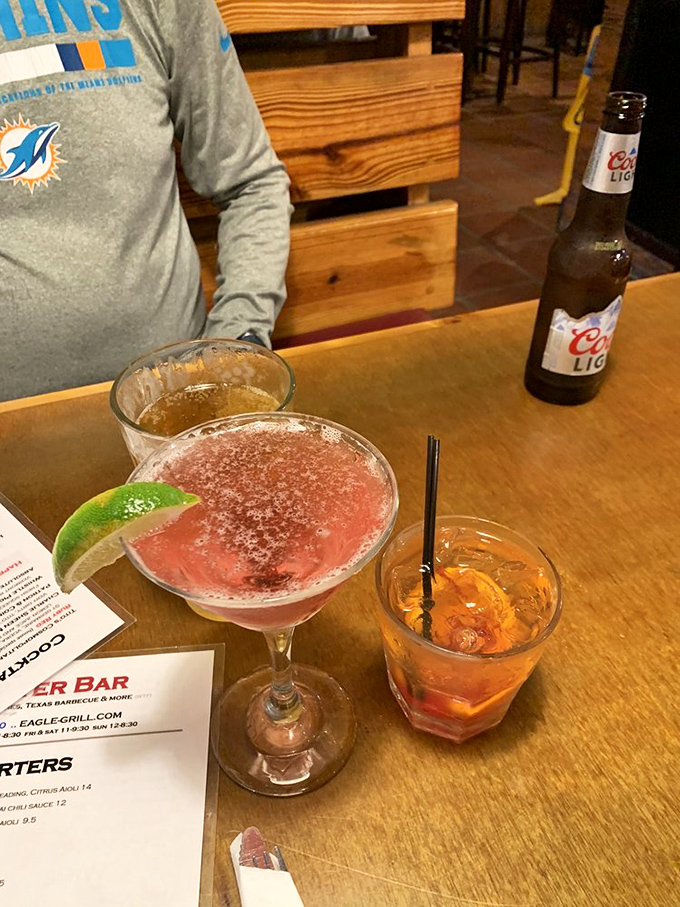 Cocktail hour done right. That pink martini isn't just a drink—it's the beginning of a very good decision-making process.