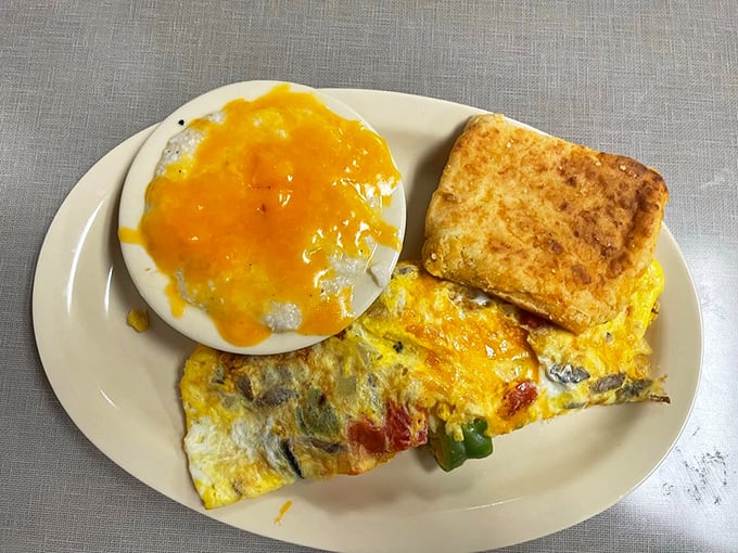 Morning sunshine on a plate. This omelet, packed with veggies and cheese, pairs perfectly with that golden-brown toast.