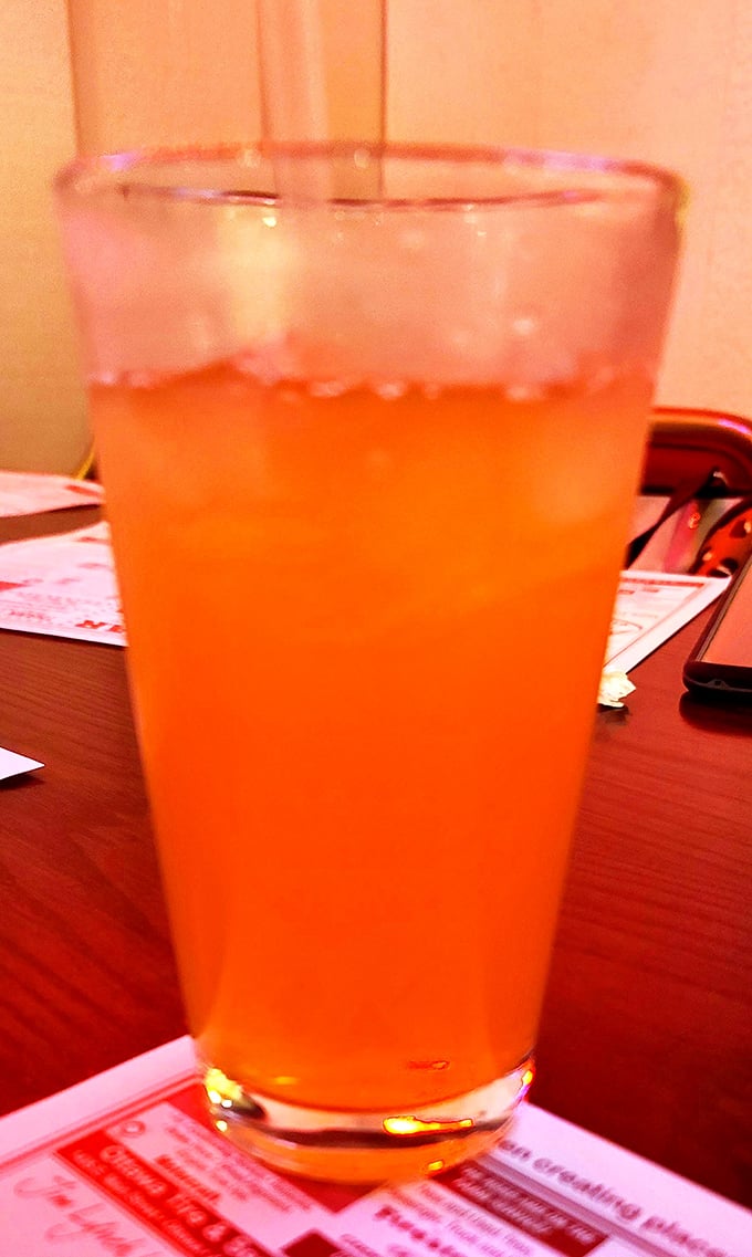 An ice-cold Orange Crush in a no-nonsense glass—sometimes the simplest pleasures are the ones we remember longest.