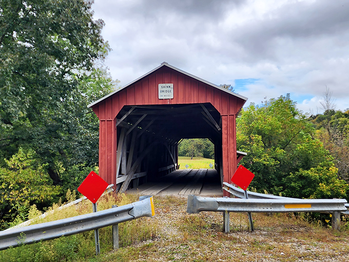 Those red diamond signs aren't just decoration—they're like traffic lights from another century, guiding travelers safely through this wooden time capsule.