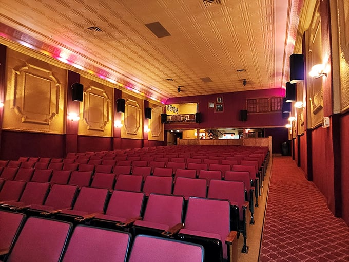 The rich burgundy seats face forward in perfect formation, like an army of comfort ready to support you through three hours of Marvel mayhem.