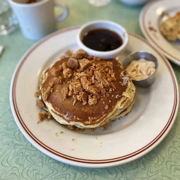 These aren't just pancakes; they're a childhood memory reimagined by someone who understands that growing up is optional when breakfast is involved.