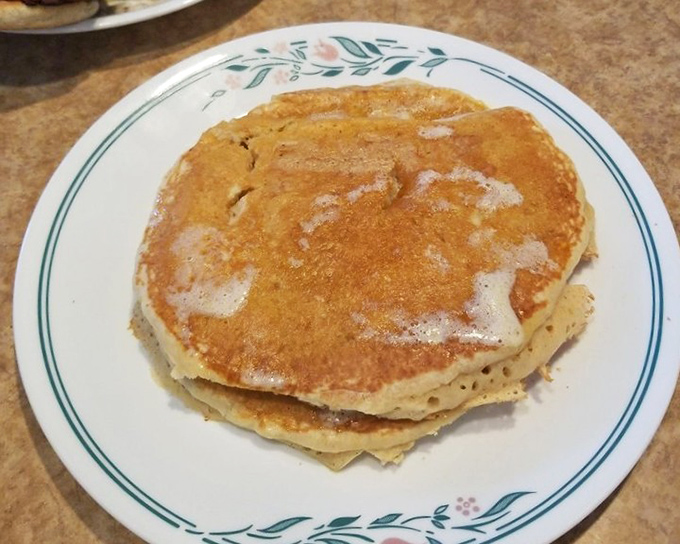 These pancakes aren't Instagram bait; they're the real deal—slightly crisp edges, tender centers, and butter melting into every delicious pore.
