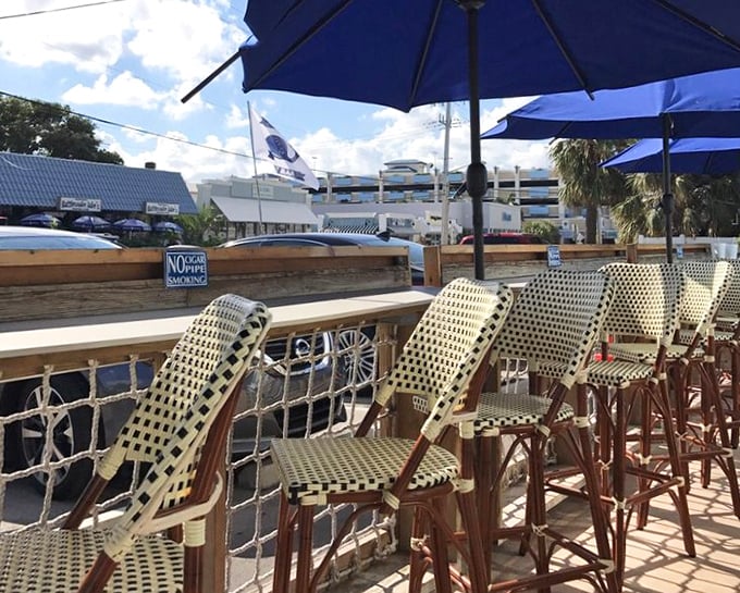 Nautical-themed outdoor seating where salt air enhances every bite, and strangers become friends over shared recommendations and seafood envy.