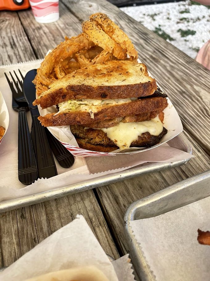 When a sandwich requires this much structural support, you know you're in for something special. Melty cheese cascading over perfectly grilled bread is comfort food poetry.