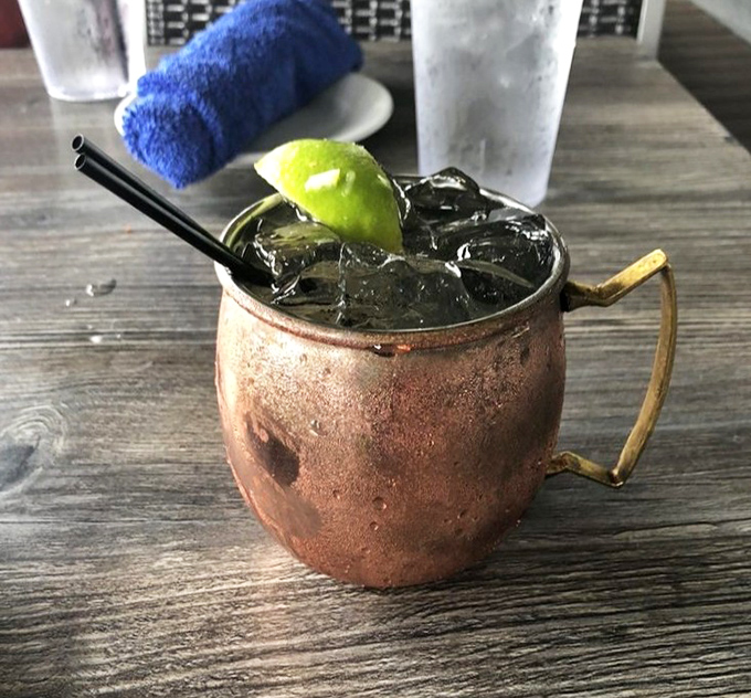 This isn't just a Moscow Mule's southern cousin—it's summer in a copper mug, waiting to complement your seafood feast.