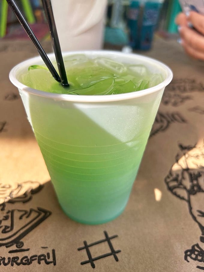 Electric blue meets tropical green in a glass. This isn't just a drink—it's South Carolina summer distilled into liquid refreshment.
