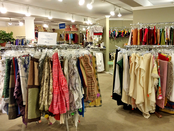 A textile rainbow of possibilities hangs in perfect order – proof that second-hand shopping doesn't mean sacrificing organization or selection.