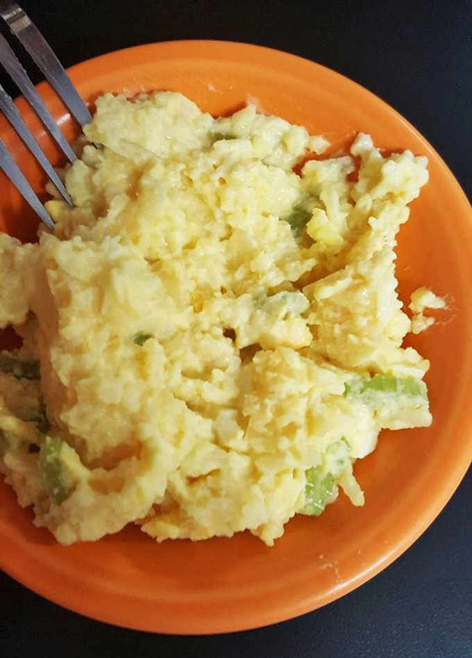 Scrambled eggs that look like they've been whispered into perfection – fluffy, bright, and ready to transform your morning from ordinary to extraordinary.