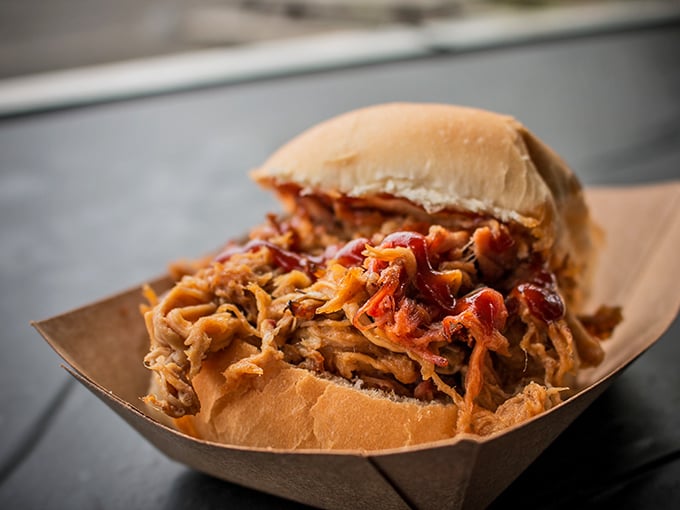 The pulled pork sandwich—a masterpiece of simplicity. The kind of sandwich that makes you cancel your afternoon plans just to sit with the memory.