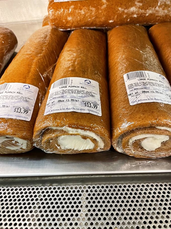 Pumpkin rolls lined up like the world's most delicious army. Fall flavors wrapped around cream cheese filling—like autumn giving you a delicious hug.