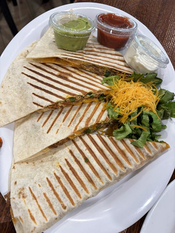 Quesadillas with the works – where Mexican-inspired comfort meets Midwestern abundance. That grill mark pattern is practically hypnotic.