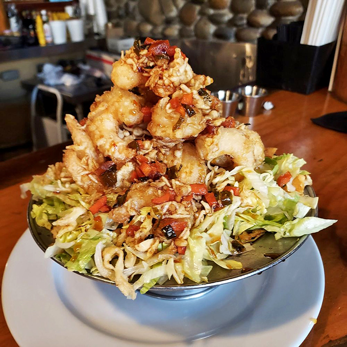 The Railroad Camp Shrimp isn't just food—it's edible architecture. These golden-fried treasures stacked atop fresh slaw could convert even the most dedicated landlubber to seafood.