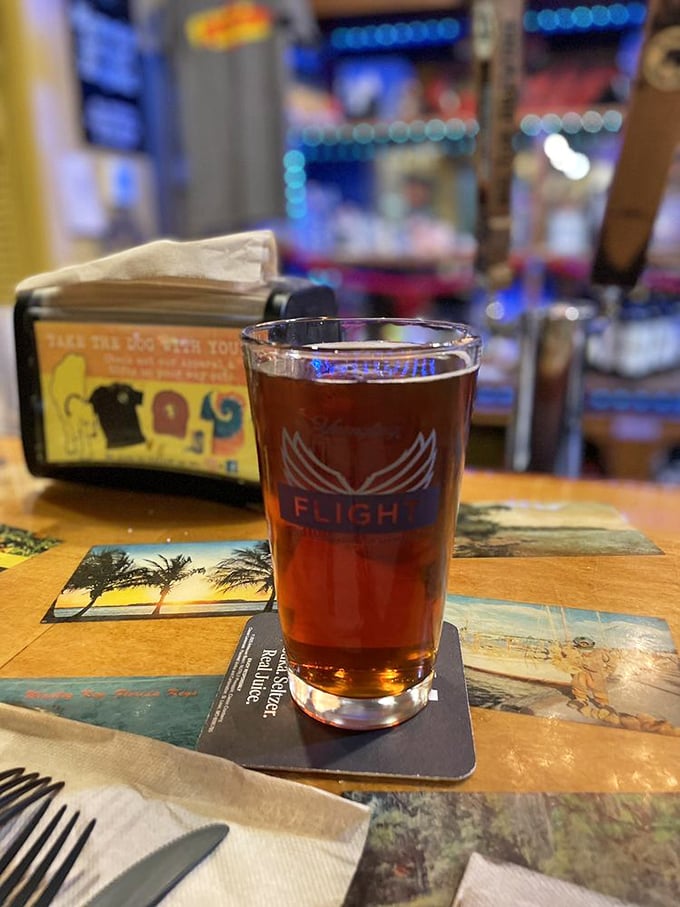A perfectly poured craft beer on a Florida-themed coaster—because great BBQ deserves an equally thoughtful beverage companion.