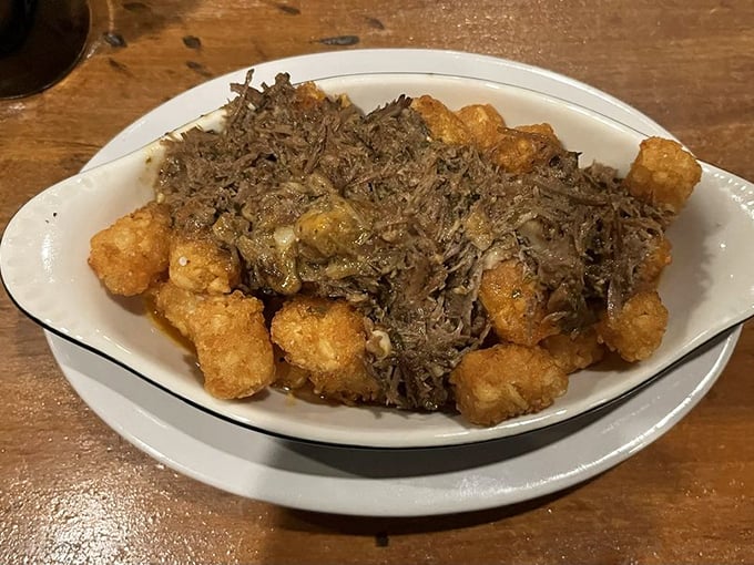 Tater tots all grown up with their inheritance. Crispy potato bites draped in savory toppings—like your childhood favorite that went to culinary school.