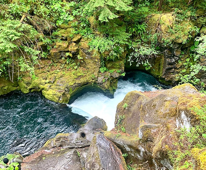 The river's turquoise personality shines through this rocky passage, a preview of the vibrant pool waiting at the falls.