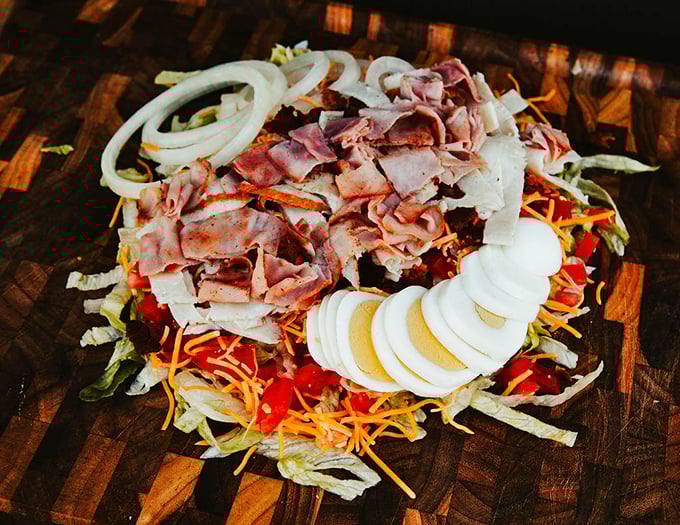 A chef salad that doesn't apologize for being generous with the good stuff. This isn't diet food – it's satisfaction in vegetable form.