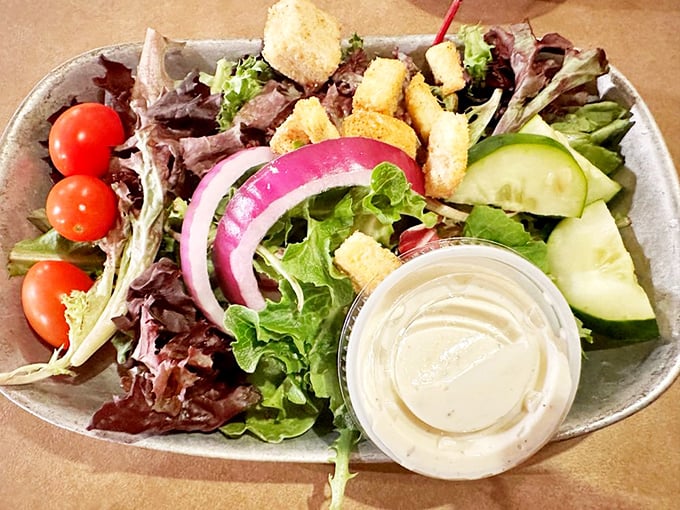 A salad at a fish house is like bringing an umbrella to the desert – technically unnecessary, but surprisingly refreshing when you need a break from all that delicious fried goodness.