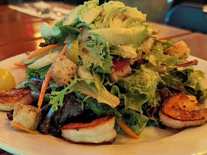 A salad that actually excites—fresh greens playing host to perfectly seared shrimp and a supporting cast of colorful vegetables.