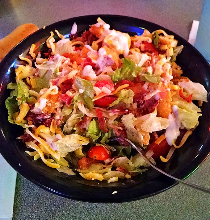 This isn't a reluctant side salad but a celebration in a bowl—crisp lettuce, vibrant vegetables, and cheese that reminds you salads don't have to be punishment.