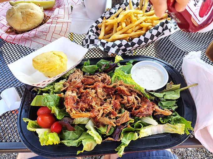 Even salad gets the star treatment here—pulled pork lounging on crisp greens like it's at a spa day, bringing smoky sophistication to the veggie party.