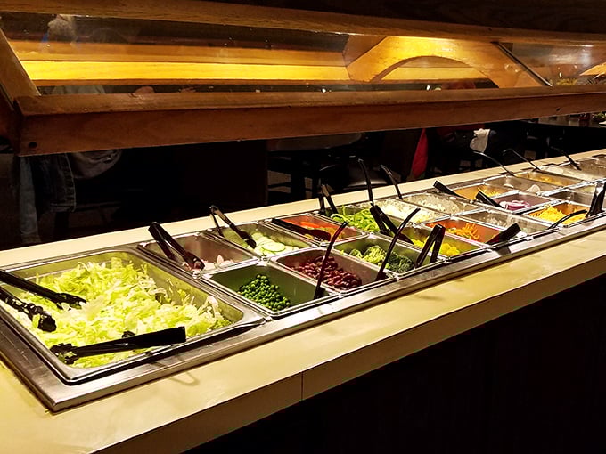 The salad bar—that magnificent 1970s invention where iceberg lettuce became a canvas for your culinary creativity. Load up those tongs and express yourself!