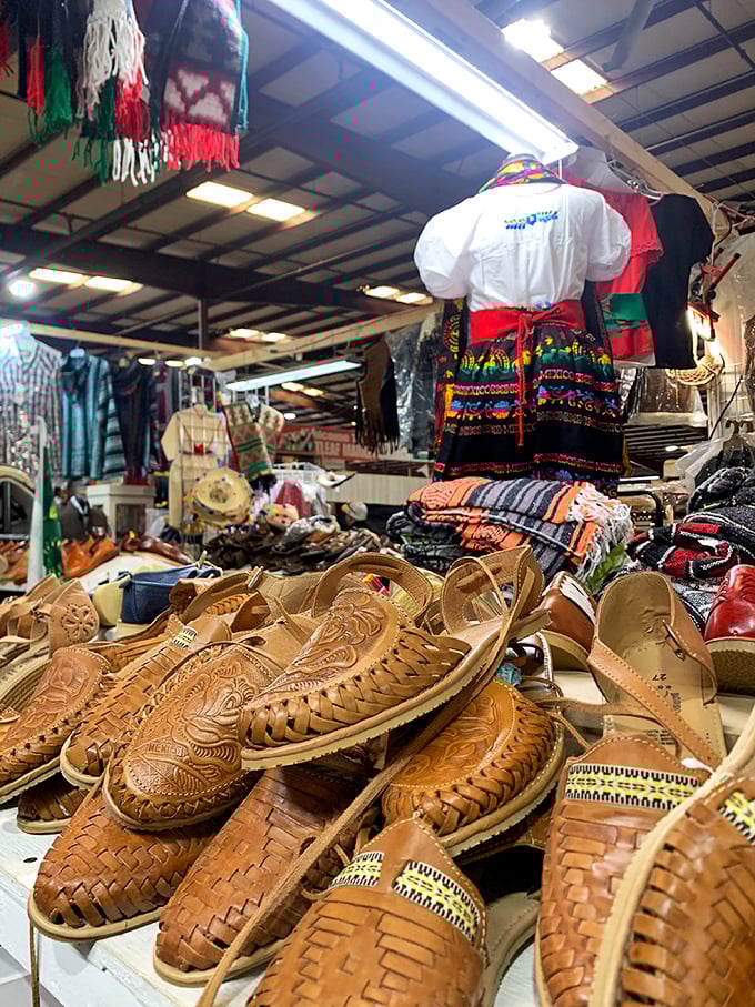 Intricately woven huaraches tell stories of craftsmanship while traditional garments hang above, cultural treasures hiding in plain sight among everyday finds.