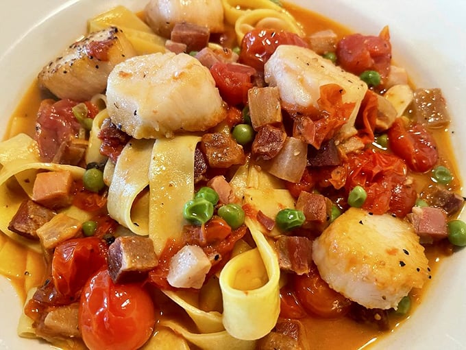 A symphony of scallops, pancetta, and pappardelle that makes you realize why Italians talk with their hands – words simply aren't enough.